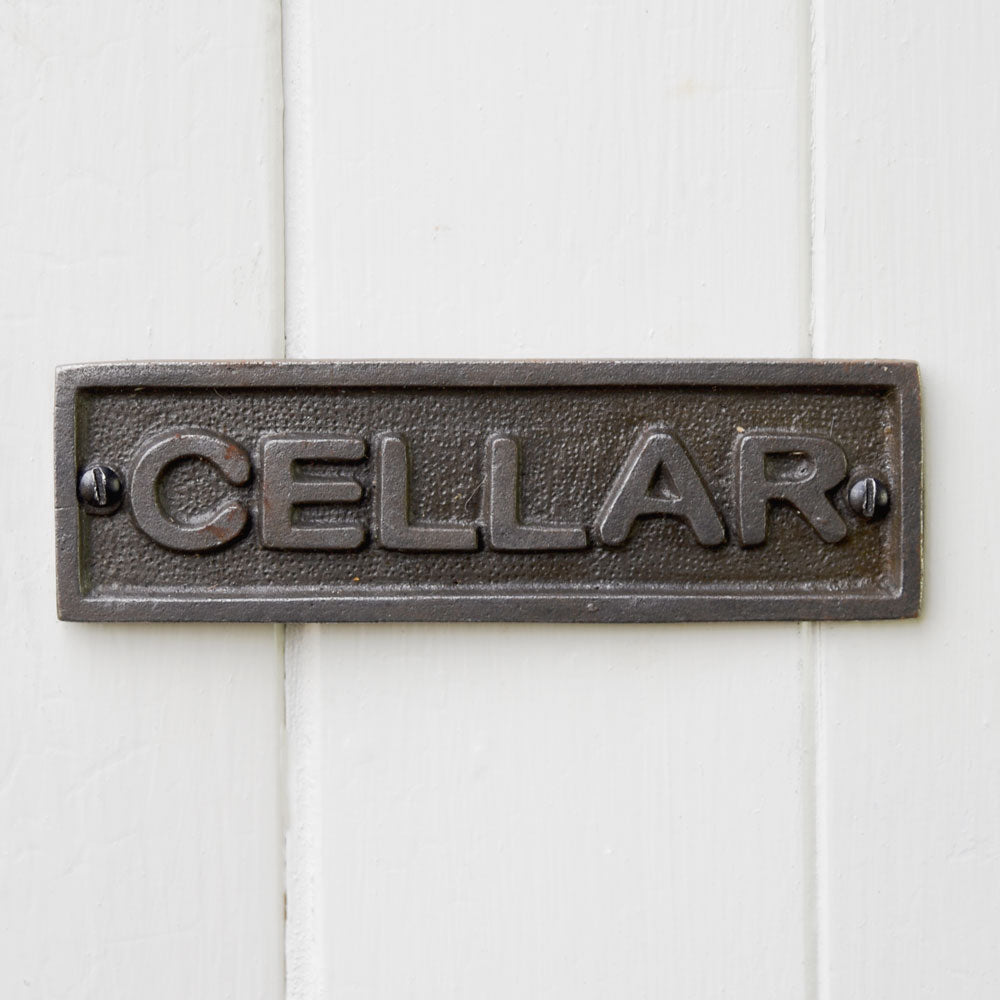 Traditional cast metal cellar door sign