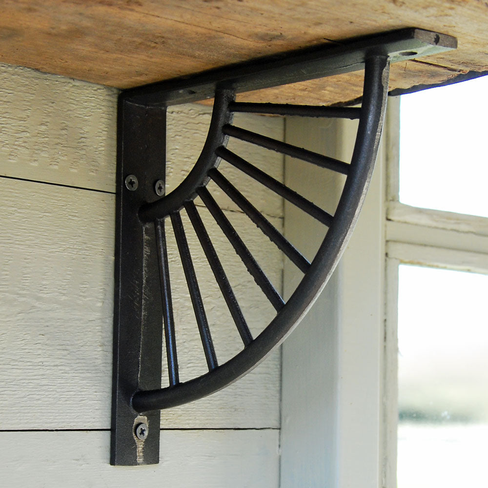 Cartwheel cast iron wall shelf bracket